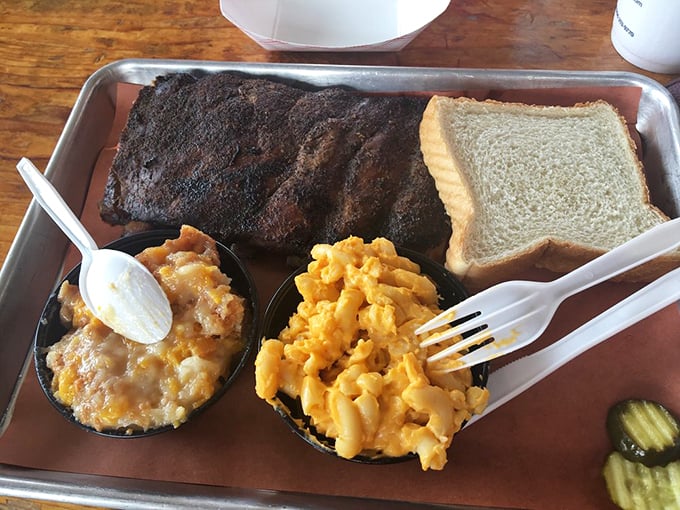 Half rack? More like half heaven! This plate is a symphony of flavors, with ribs conducting an orchestra of mac and cheese and baked beans.