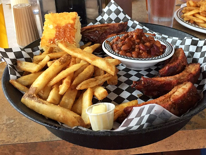 The perfect trifecta: ribs, fries, and mac & cheese. It's like comfort food got dressed up for a night on the town.