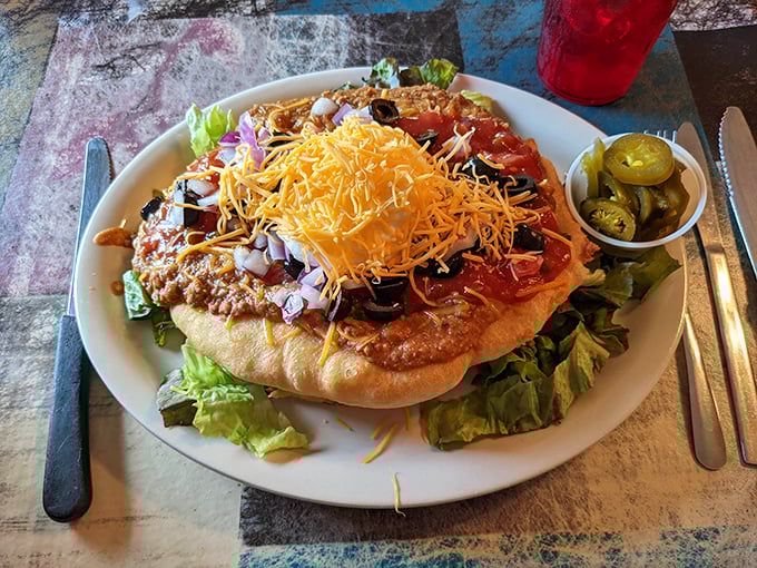 Holy fry bread, Batman! This Indian Taco is a superhero-sized feast that'll have your taste buds doing a happy dance.