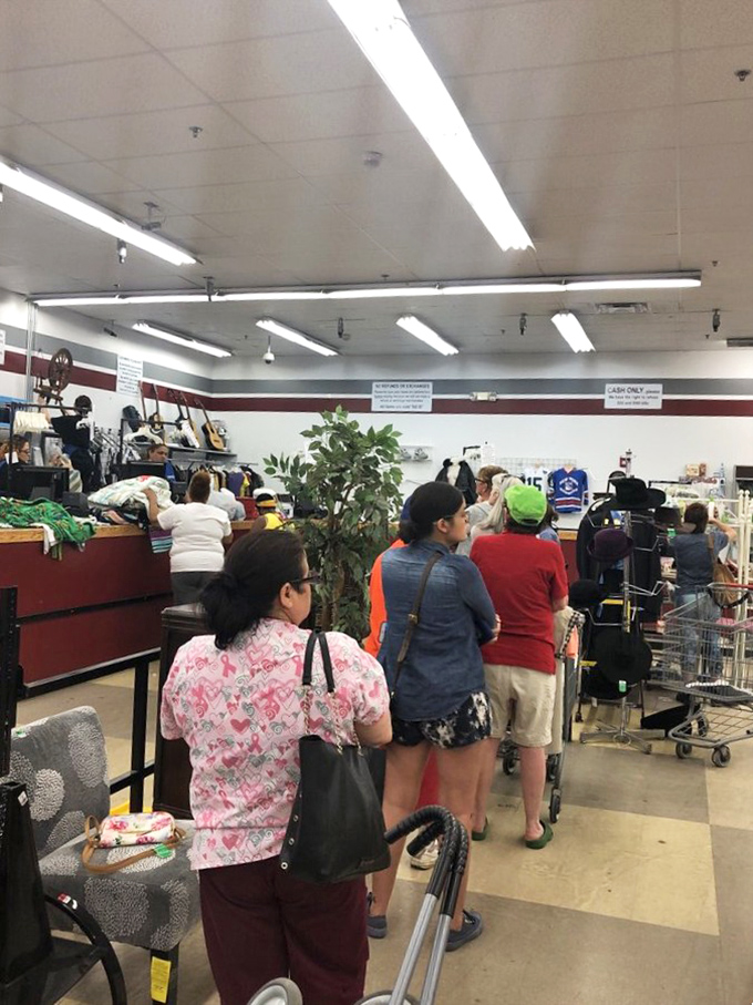 "The line to savings paradise! These thrifty shoppers know that patience is a virtue, especially when vintage finds are the reward."