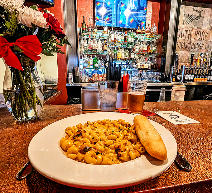 A plate of South Fork's iconic mac and cheese awaits at the bar&mdash;proof that sometimes the simplest pleasures create the most profound memories.