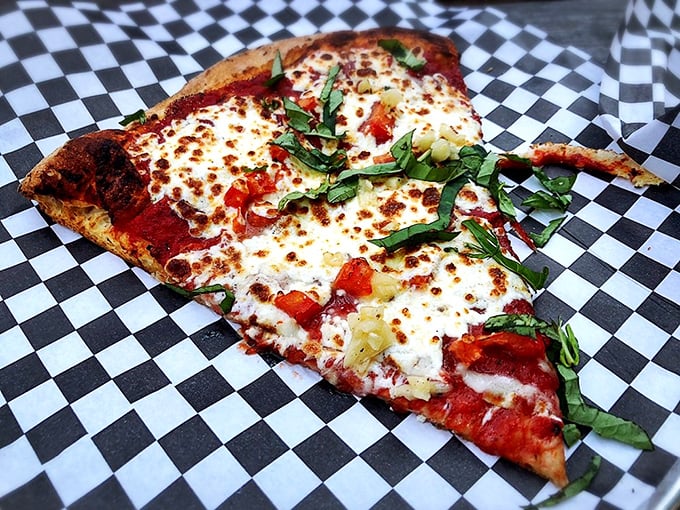 The Manhattan Margherita: where simplicity meets sophistication. Fresh basil, melty mozzarella, and a crust so perfect, it's practically a work of art.