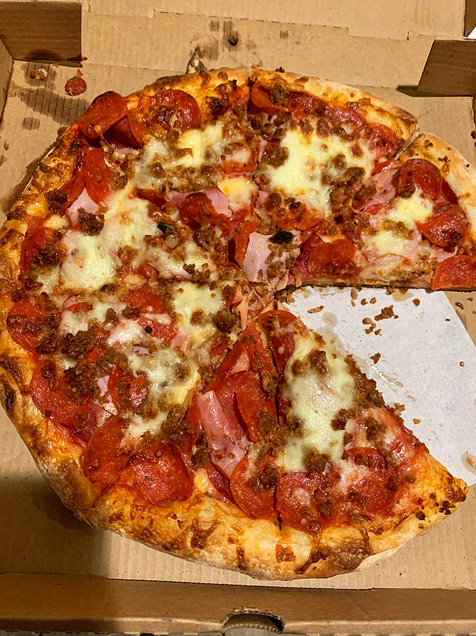 Meat lovers, rejoice! This pizza's packing more protein than a bodybuilder's lunchbox. It's a carnivore's dream come true.
