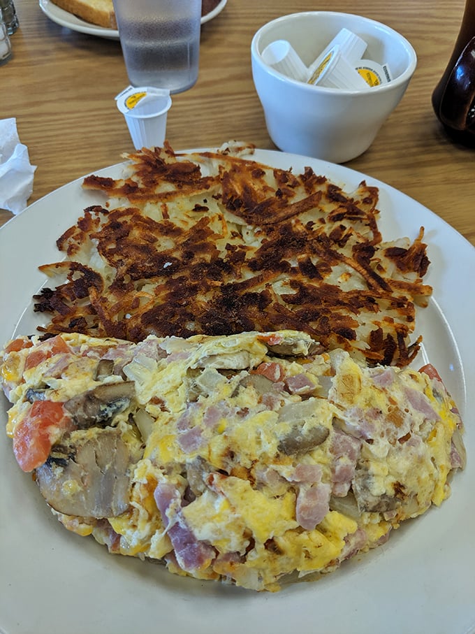 This omelet is fluffier than a cloud and packed tighter than a clown car. It's a breakfast circus in every bite!