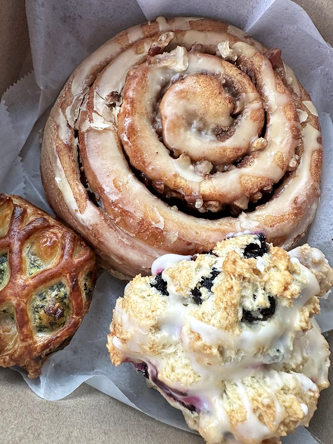 The holy trinity of breakfast indulgence: a pecan-studded cinnamon roll, a lemony blueberry scone, and zero regrets.