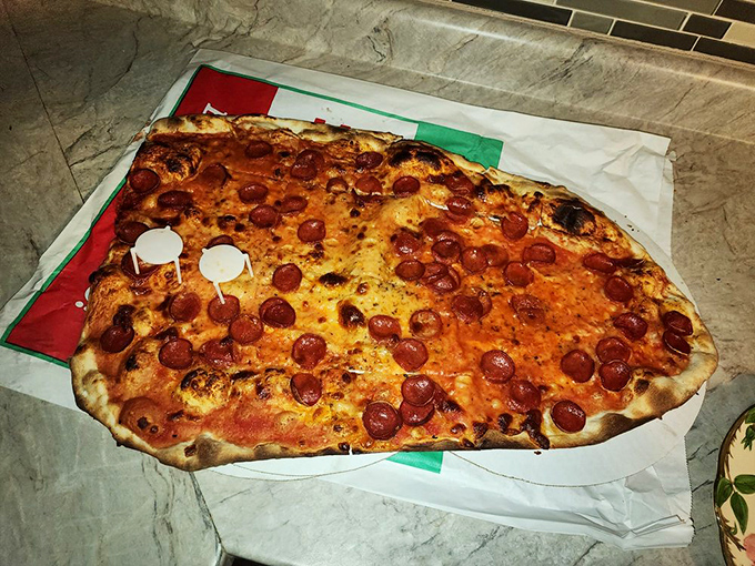 Pepperoni paradise! Each slice is a canvas of crispy, curled meat circles, promising a flavor explosion that'll make your taste buds do the happy dance.