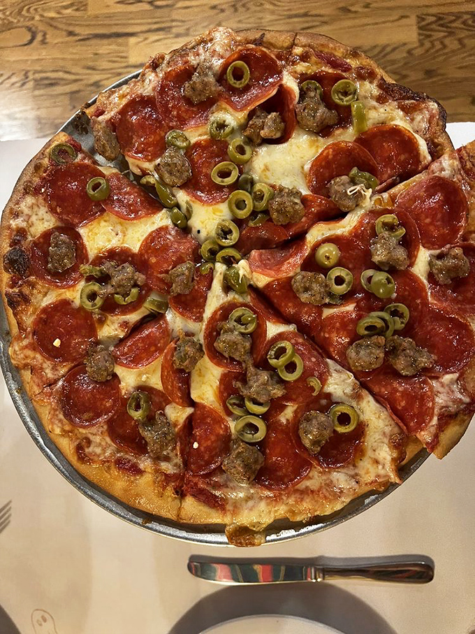 The holy trinity of toppings! Pepperoni, sausage, and olives dance together in perfect harmony on this flavor-packed pie.