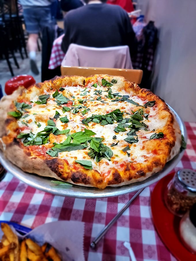 A work of art you can eat! This pizza's vibrant toppings and perfectly charred crust are almost too pretty to devour... almost.