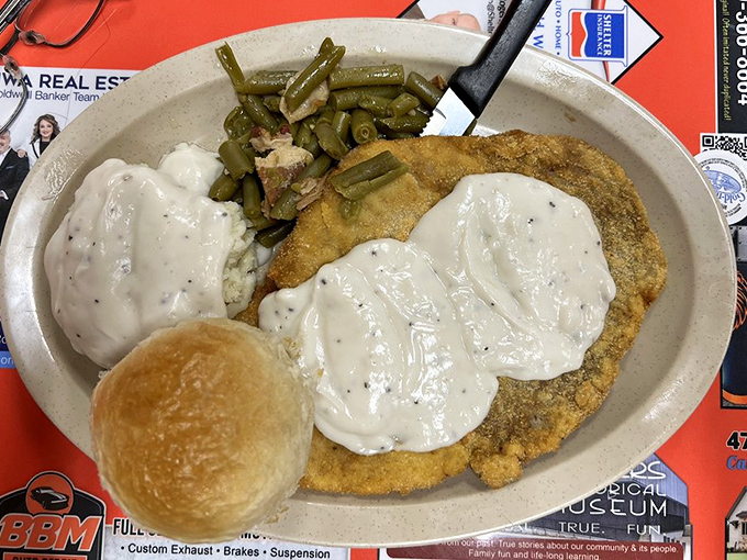 Country cooking perfection: The pork tenderloin meal with creamy mashed potatoes, green beans, and gravy that could make a grown person weep.