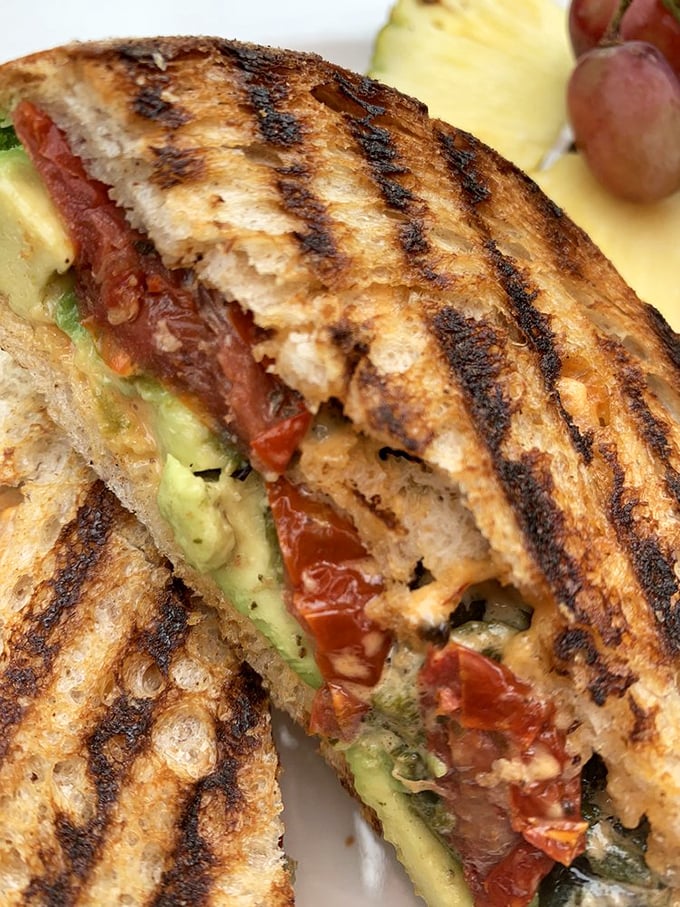 Avocado toast, meet your cooler German cousin. This grilled panini is what would happen if a Reuben went to Coachella.