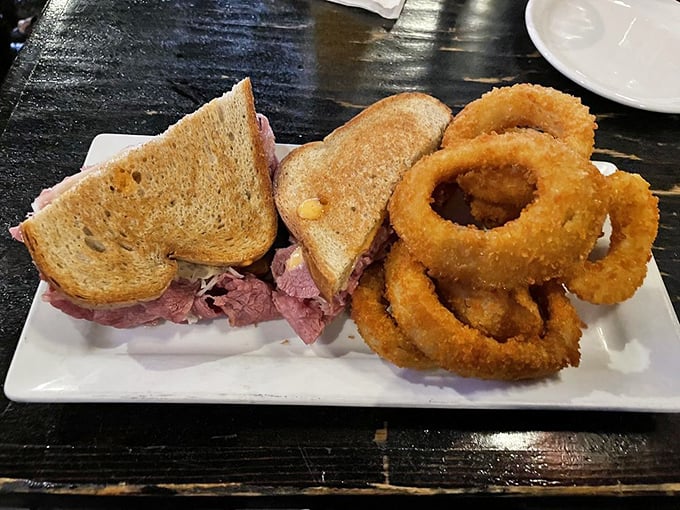 The dynamic duo: A Reuben that could make New York jealous, paired with onion rings crispier than your vacation tan lines.
