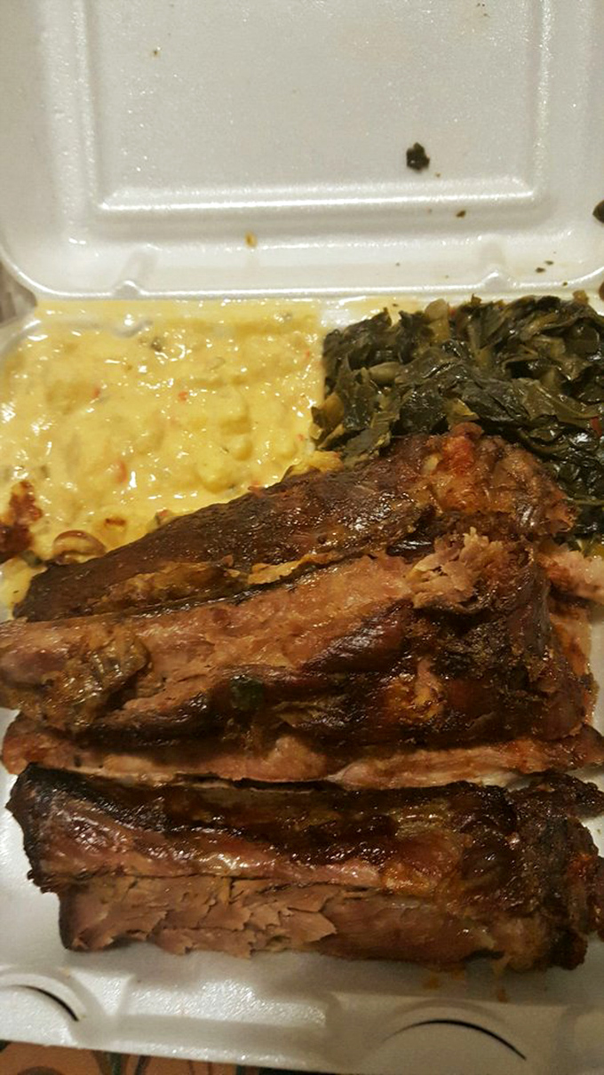 The holy trinity of barbecue perfection: ribs, mac and cheese, and collard greens. It's like a warm, Southern hug for your taste buds.