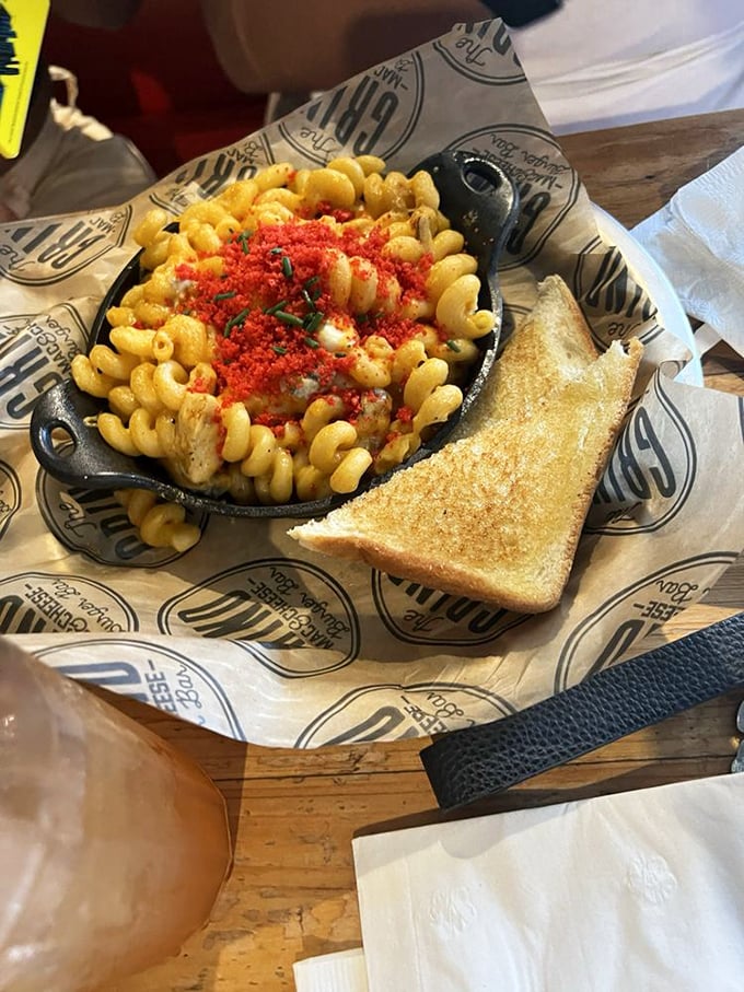 The red-dusted mac and cheese comes with buttery toast for dipping. It's not a meal, it's a religious experience with carbs.