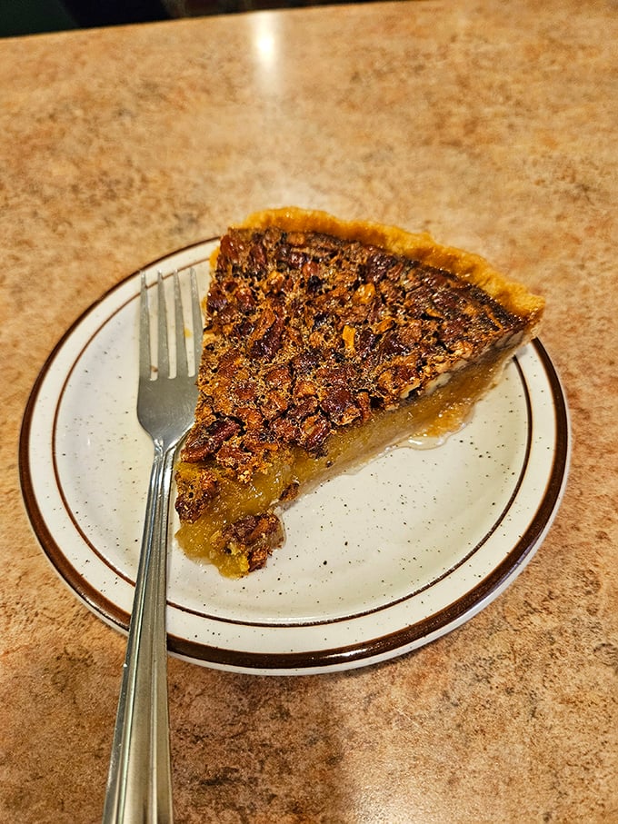 Pecan pie that strikes the perfect balance between gooey center and crunchy top. Fork optional, moment of silence mandatory.