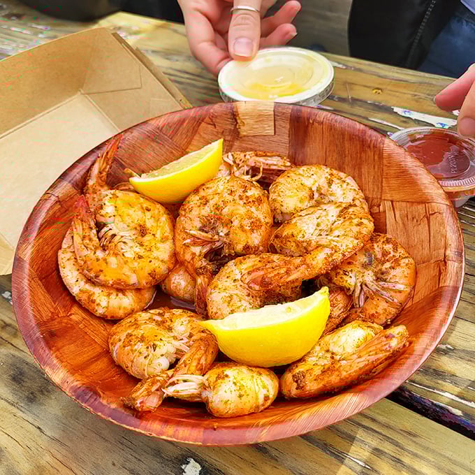 Seafood lovers, rejoice! This wooden bowl of succulent shrimp is like a treasure chest from Neptune's own kitchen.