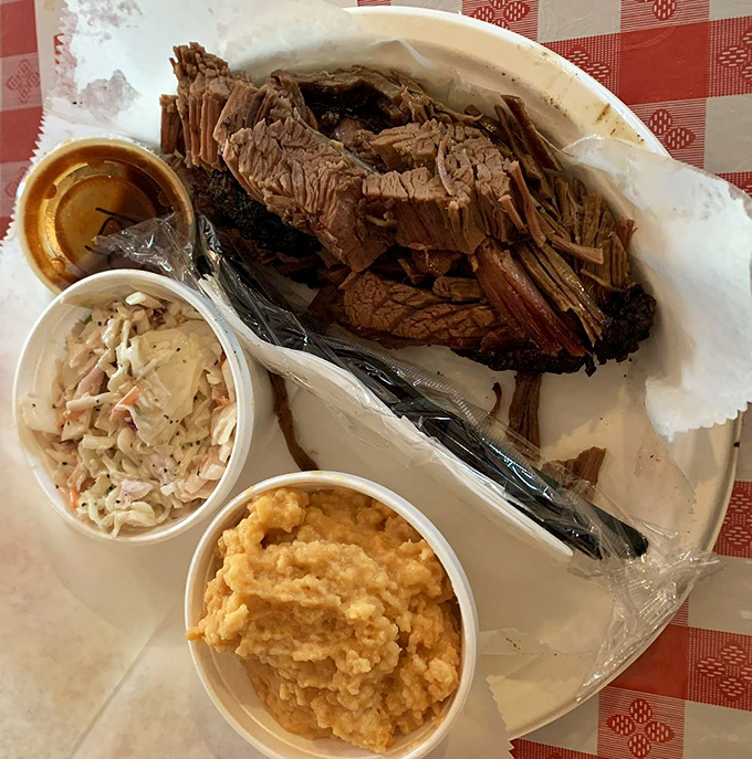 Brisket so tender, it practically slices itself! This plate is a testament to the magic that happens when meat meets smoke in a long, slow dance of deliciousness.