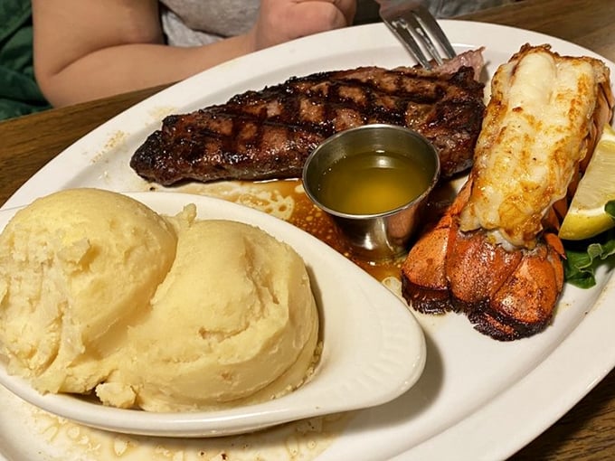 Surf and turf, the dynamic duo of dinners! This plate is like the Avengers of meals - a heroic steak, a lobster sidekick, and mashed potatoes to save the day.