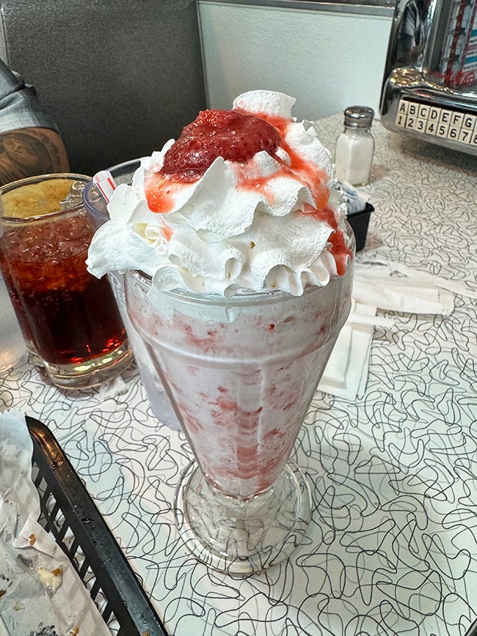 This strawberry milkshake isn't just thick; it's got more body than a 1950s pin-up calendar. Prepare for a delicious arm workout!