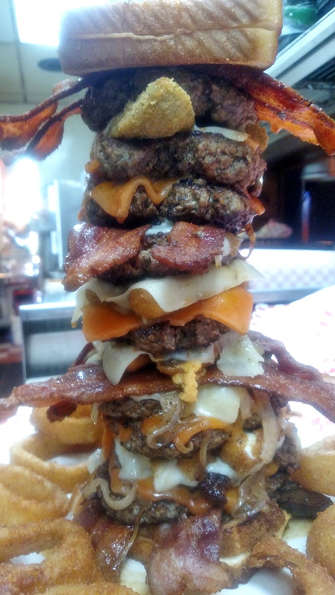 The Leaning Tower of Cheesa! This burger stack is a testament to the art of indulgence. Bring your appetite and maybe a crane to tackle this beauty.