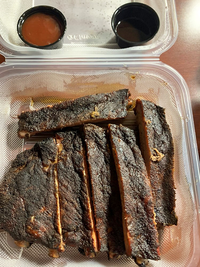 Behold, the bark side of the moon! These ribs are sporting a crust so perfect, it's like they've been touched by the barbecue gods themselves.