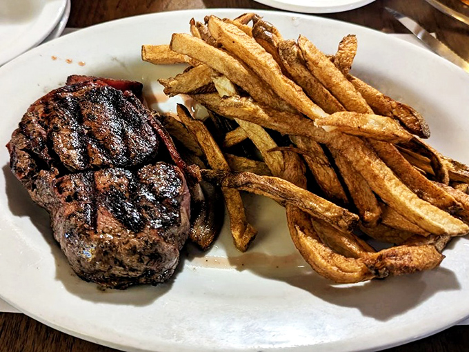 A Top Sirloin that's dressed to impress, with a supporting cast of golden fries. It's a plate that screams "comfort food royalty."