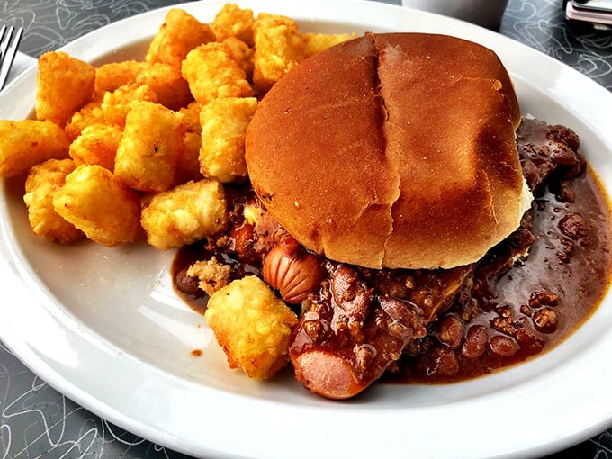 Chili dog or work of art? This messy masterpiece proves that sometimes, the most delicious things in life are the hardest to eat gracefully.