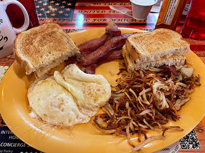 The breakfast trinity: perfectly cooked eggs, crispy hash browns, and toast that's achieved that magical golden-brown state that home toasters never quite manage.