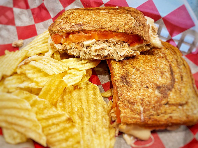 Golden-grilled bread reveals its molten treasure within&mdash;a tuna melt that puts ordinary versions to permanent shame.