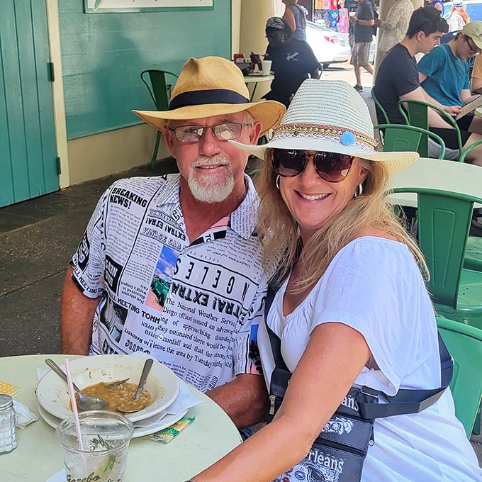 Hats off to these market mavens! Nothing says "vacation mode" quite like newspaper-print shirts and sun-kissed smiles.