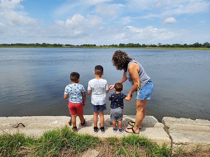 Family fun by the shore! These little explorers are probably wondering if they'll spot any dragons... or maybe just a really big catfish.