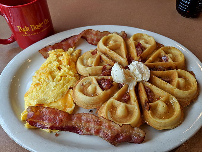 These waffles aren't just breakfast, they're architecture&mdash;golden buttermilk cathedrals topped with bacon and perfectly scrambled eggs. The holy trinity of morning meals.