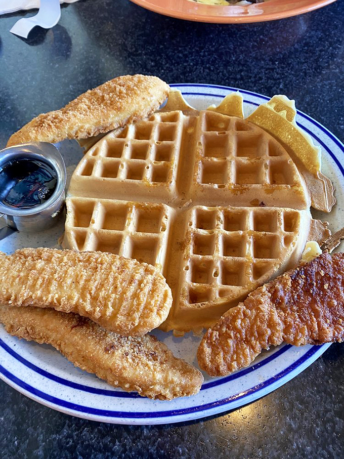 Who says you can't have it all? This waffle and fish combo is the culinary equivalent of wearing a tuxedo to the beach – unexpectedly perfect.