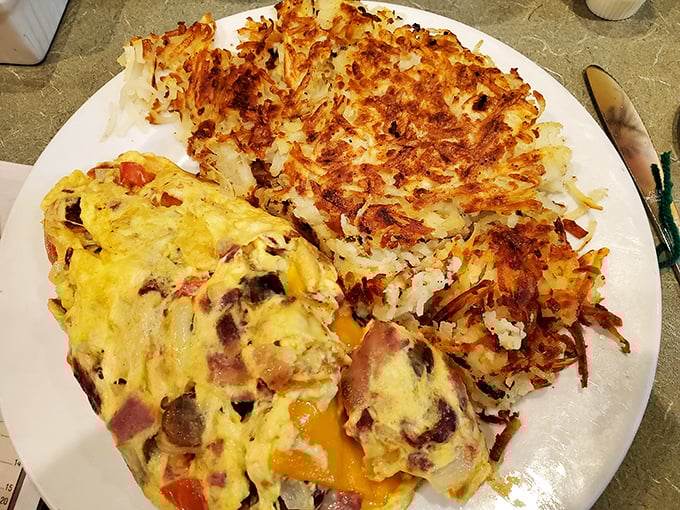 The 'Works' omelet - where every ingredient in the kitchen decided to throw a party. It's like a flavor fiesta wrapped in an eggy embrace.