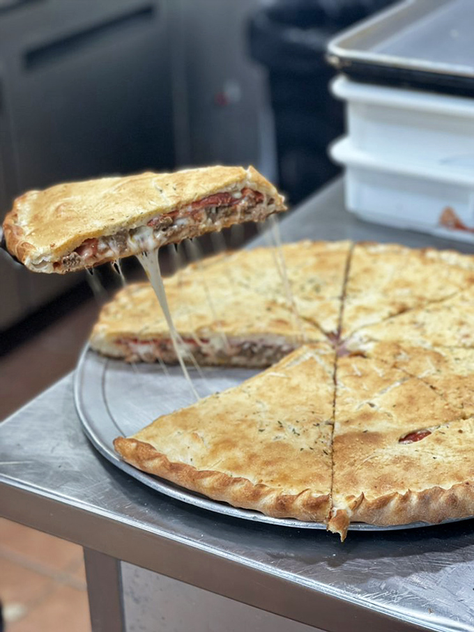 The "Stuffed Pizza" - where dough meets destiny. It's like a pizza had a dream of becoming a calzone and overachieved.