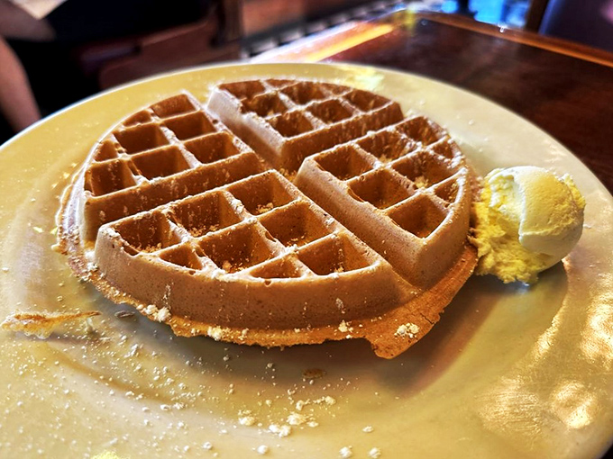 Golden, crispy, and ready for its close-up. This Belgian waffle is auditioning for the role of "Breakfast of Champions."