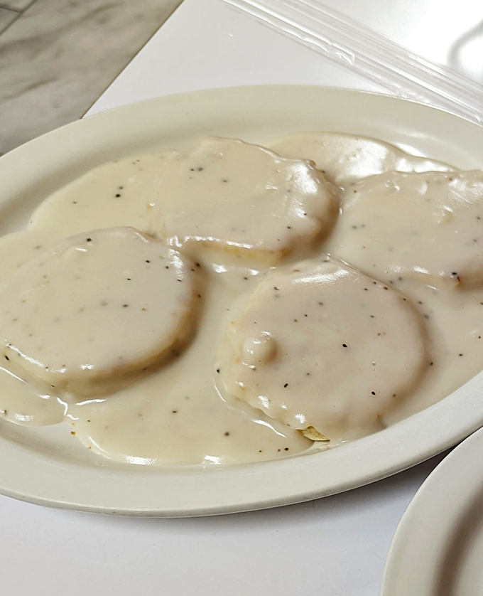 Biscuit perfection achieved! These fluffy clouds of dough are ready to soak up gravy like tiny, edible sponges sent from breakfast heaven.