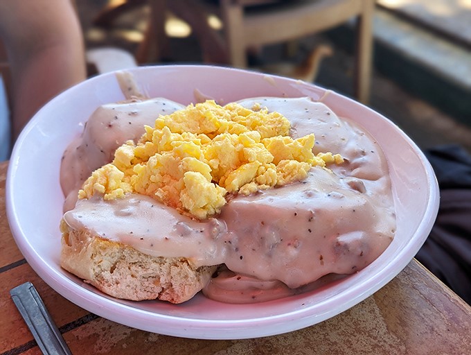 Biscuit bliss achieved! Golden, fluffy, and drowning in gravy – these beauties could make even a Southern grandma jealous.
