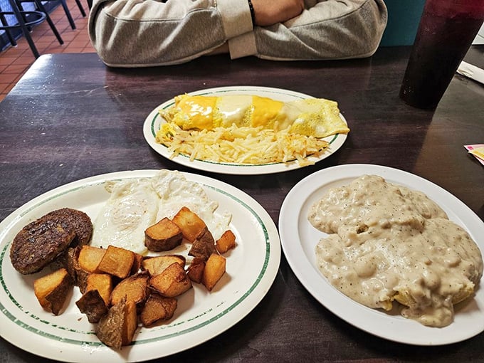 The breakfast trinity: perfectly cooked eggs, golden home fries, and a side of gravy that deserves its own zip code. Comfort food that speaks the universal language of "mmmmm."
