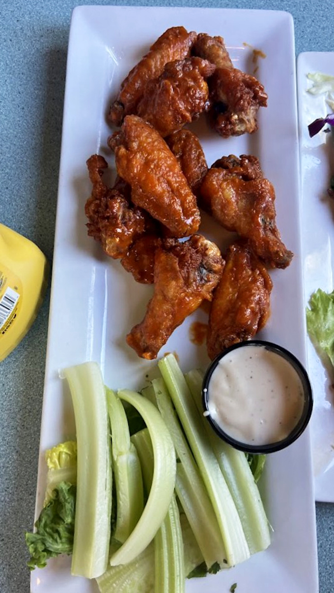 Buffalo sauce that clings to each wing like it's afraid of falling off&mdash;paired with celery sticks that know they're just along for the ride.