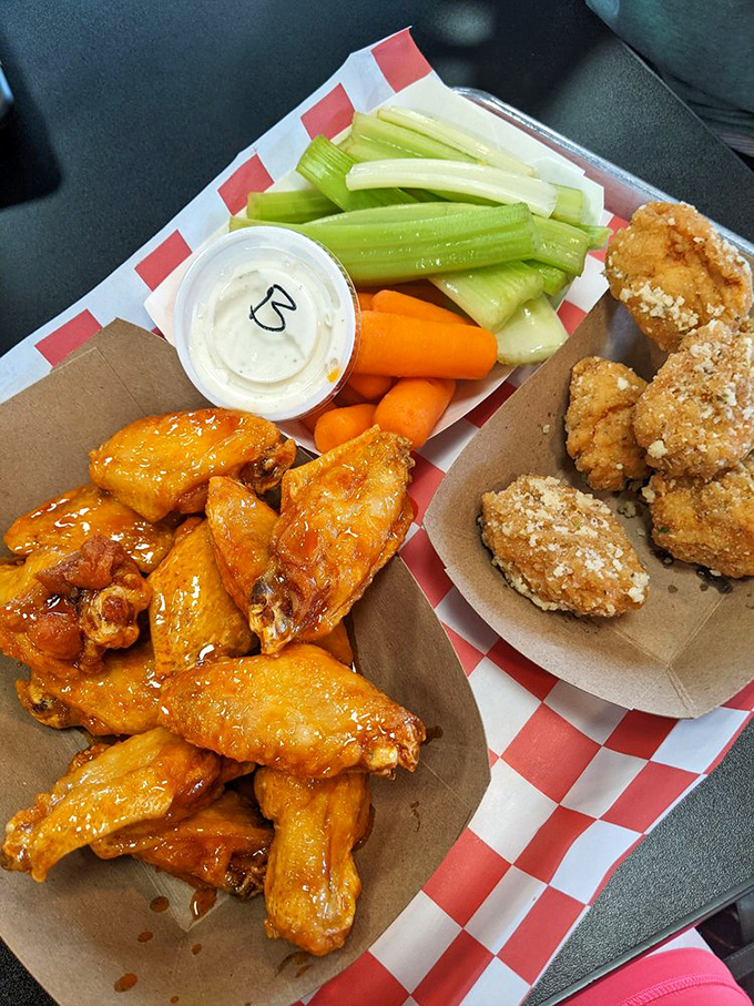 A platter of perfection! Golden wings, crisp veggies, and sauces that'll make your taste buds do the cha-cha.