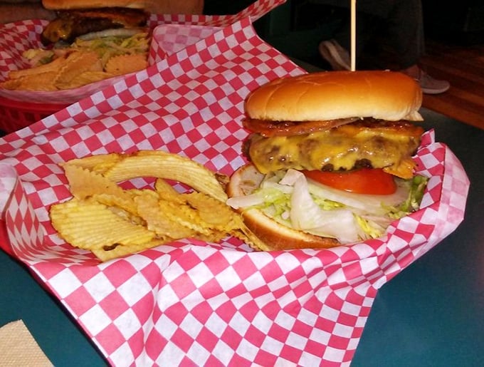 Hold onto your napkins, folks! This burger is stacked higher than a Jenga tower and twice as likely to topple &ndash; deliciously.