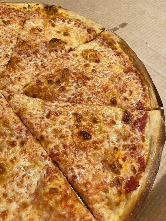 Cheese, please! This classic slice is so good, it'll make you forget about your diet faster than you can say "extra mozzarella."