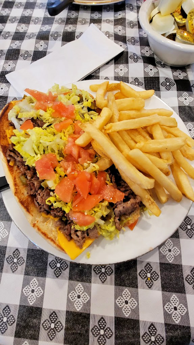 The ultimate comfort food trifecta: Gooey cheese, savory beef, and crispy fries. It's like a hug for your mouth!