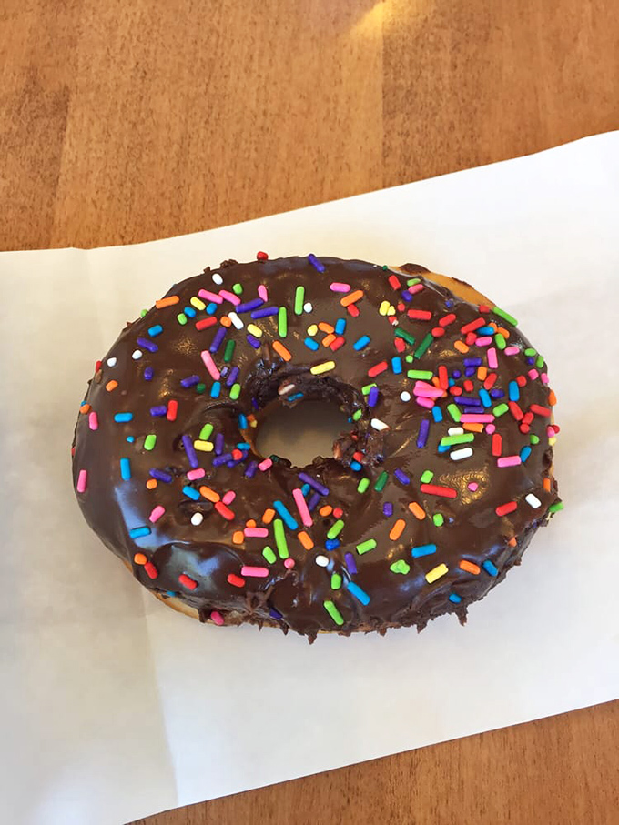 Sprinkle me happy! This chocolate donut is dressed to impress, like a disco ball for your taste buds.