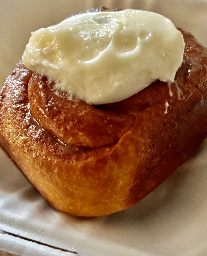 Behold, the crown jewel of breakfast pastries! This cinnamon roll is so perfectly swirled, it could hypnotize you into a sugar-induced trance.
