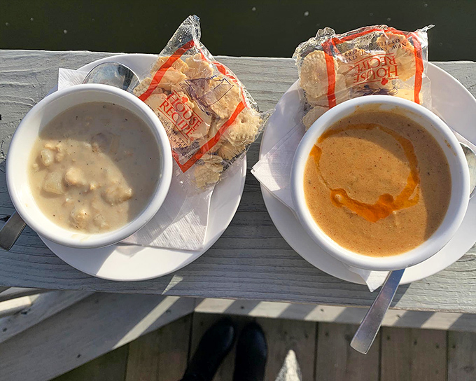 A tale of two soups: creamy clam chowder and vibrant she-crab soup. It's like the ocean decided to have a dance-off in your mouth.