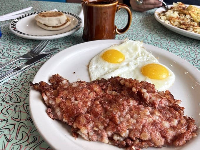 Corned beef hash with sunny-side-up eggs&mdash;the breakfast equivalent of finding a twenty in your winter coat. That crispy exterior hiding tender corned beef deserves its own fan club.