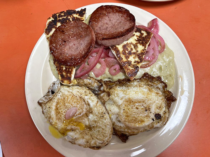 Eggs so perfectly fried, they could make a hen proud. Paired with sausage and cheese, it's the breakfast of champions (and night owls).