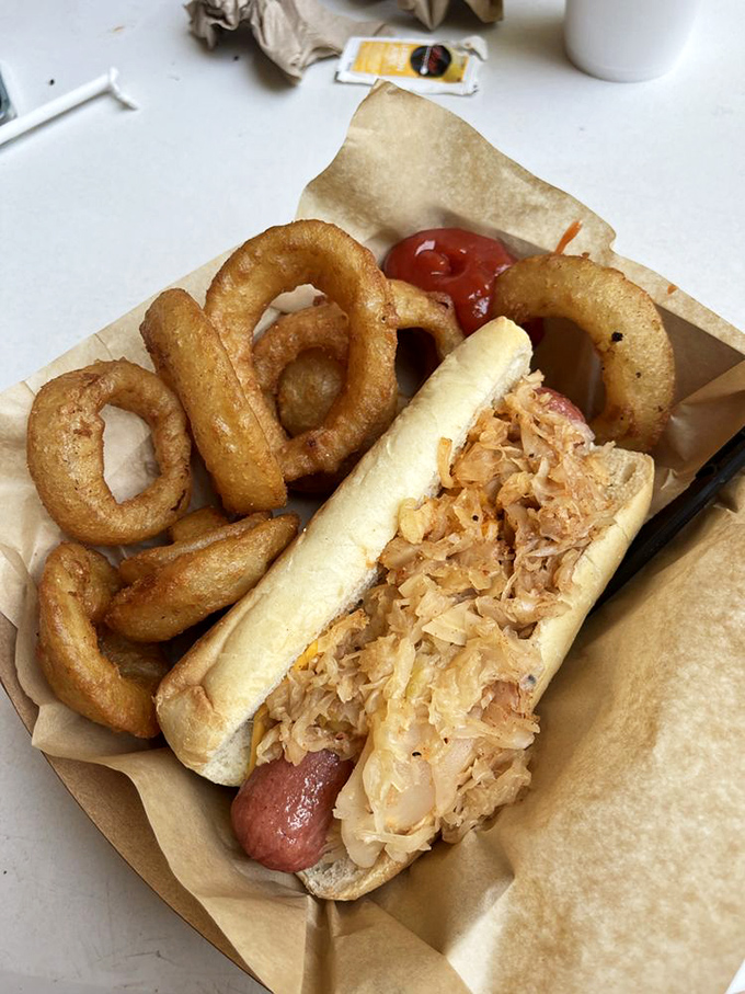 Hot diggity dog! This loaded frankfurter comes with a side of crispy onion rings that could double as golden lassos.