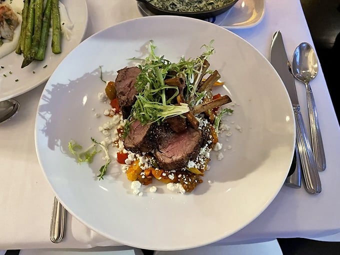 Lamb chops that could make even Mary's little lamb jealous. Perfectly seared and artfully plated, this dish is a carnivore's dream come true.